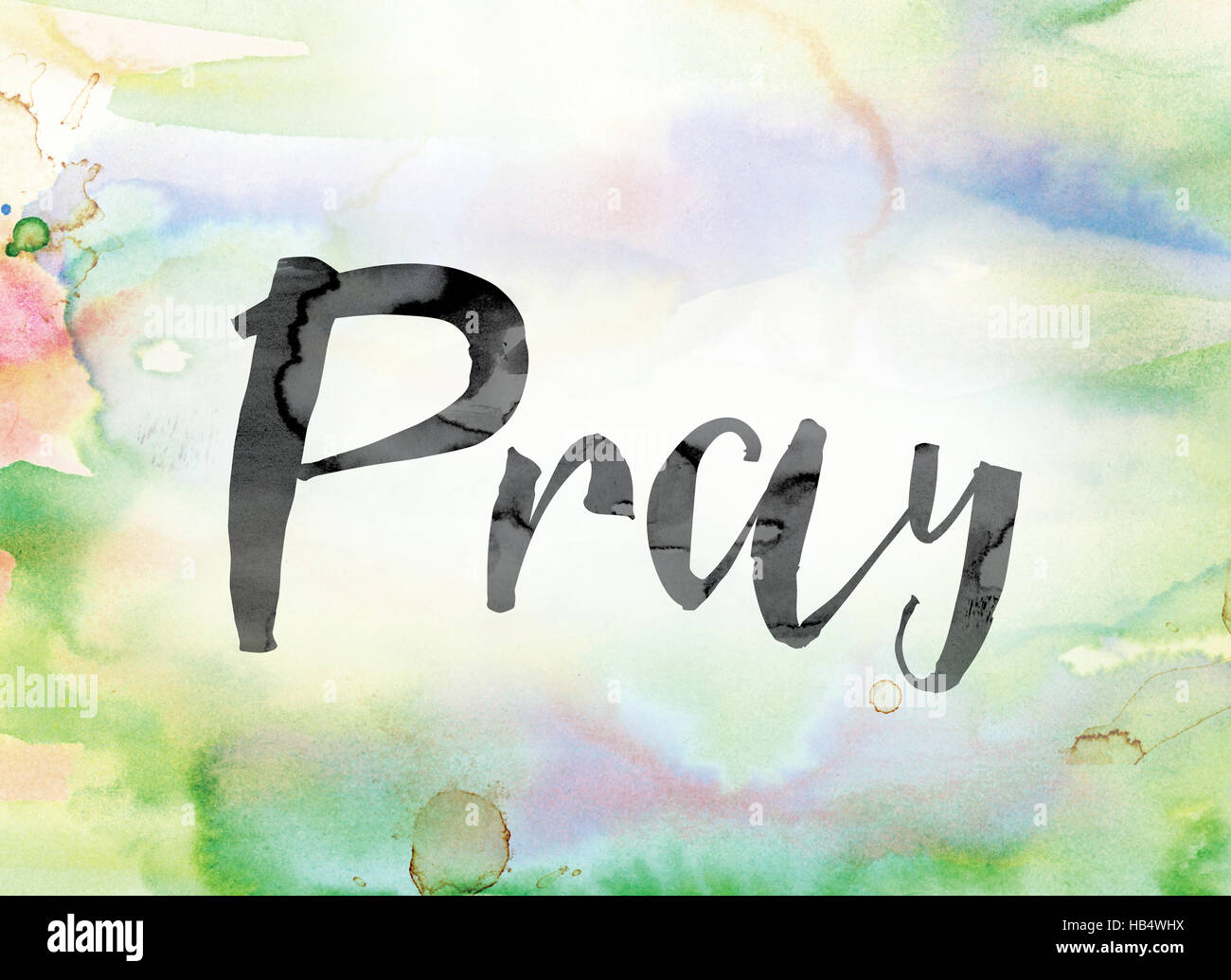 The word "Pray" painted in black ink over a colorful watercolor washed ...