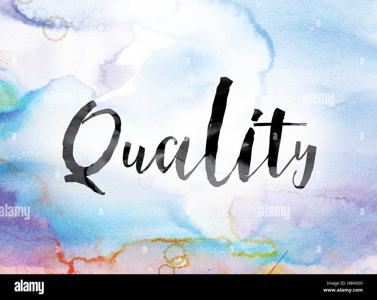The word "Quality" painted in black ink over a colorful watercolor ...