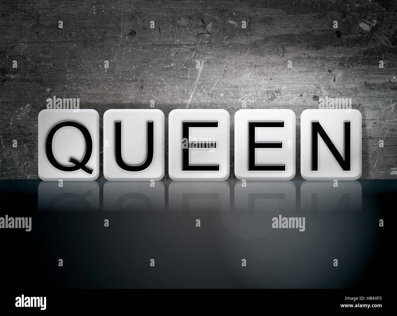 The word "Queen" written in white tiles against a dark vintage grunge ...