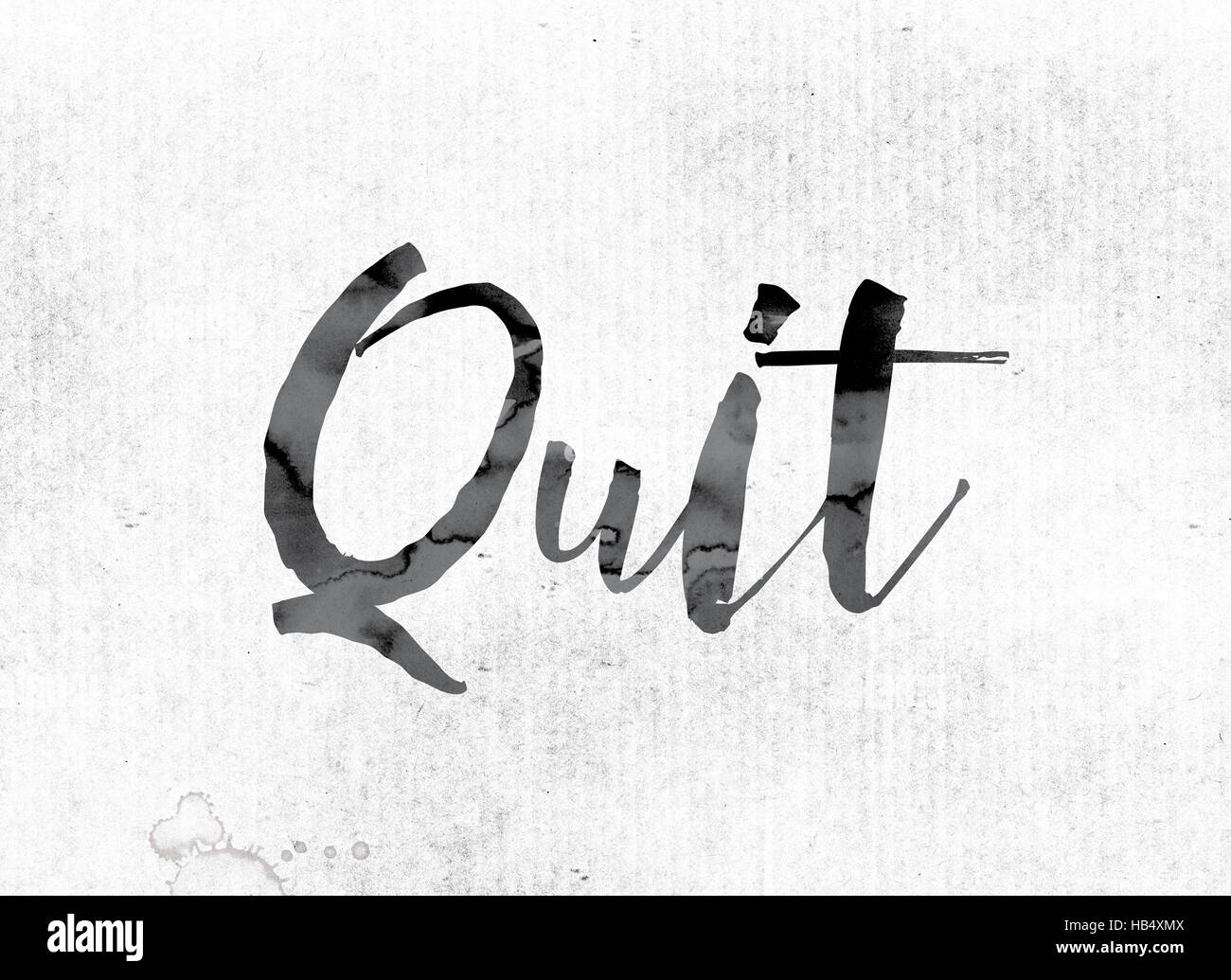 The word "Quit" concept and theme painted in watercolor ink on a white ...