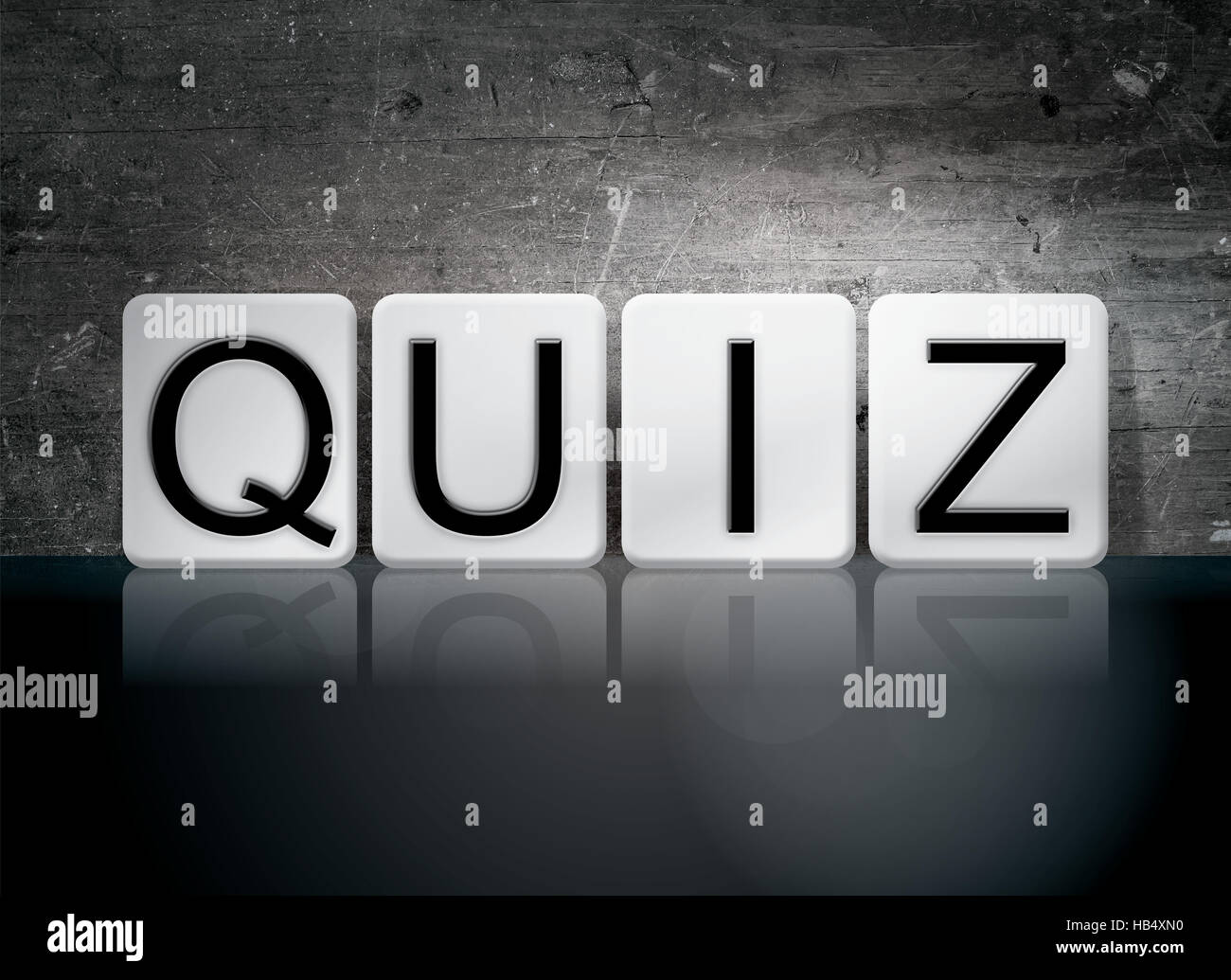The word "Quiz" written in white tiles against a dark vintage grunge ...