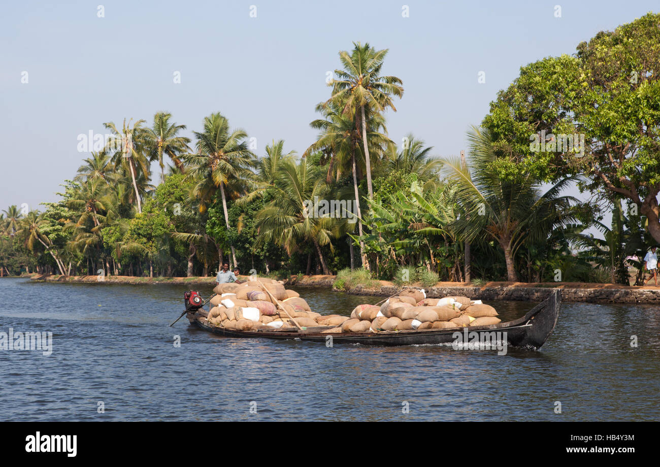 Fully loaded rice barge on the backwaters of Kerala, India Stock Photo ...