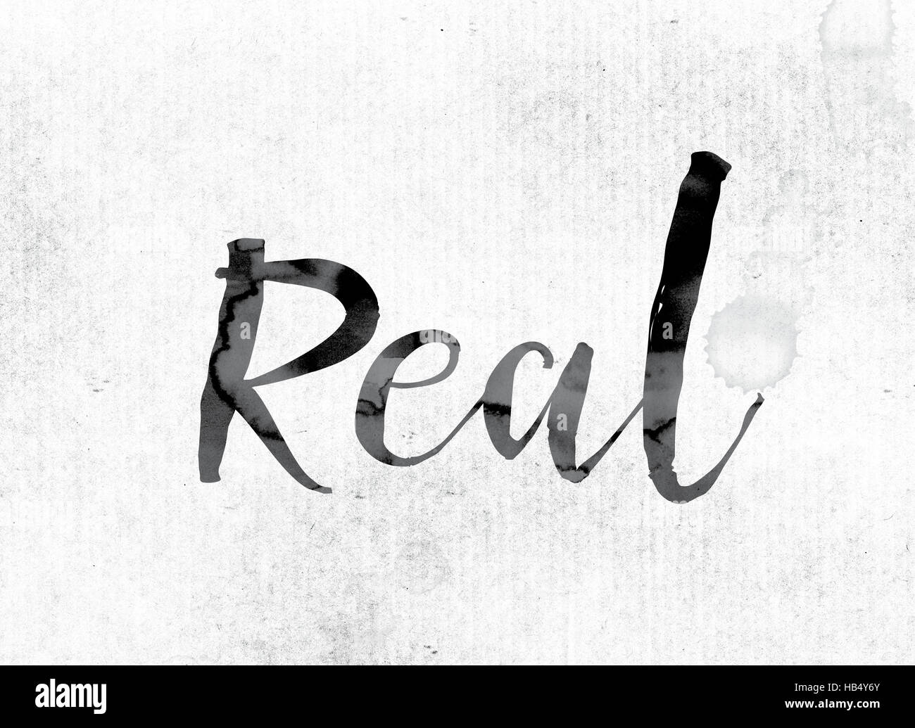 The word "Real" concept and theme painted in watercolor ink on a white ...