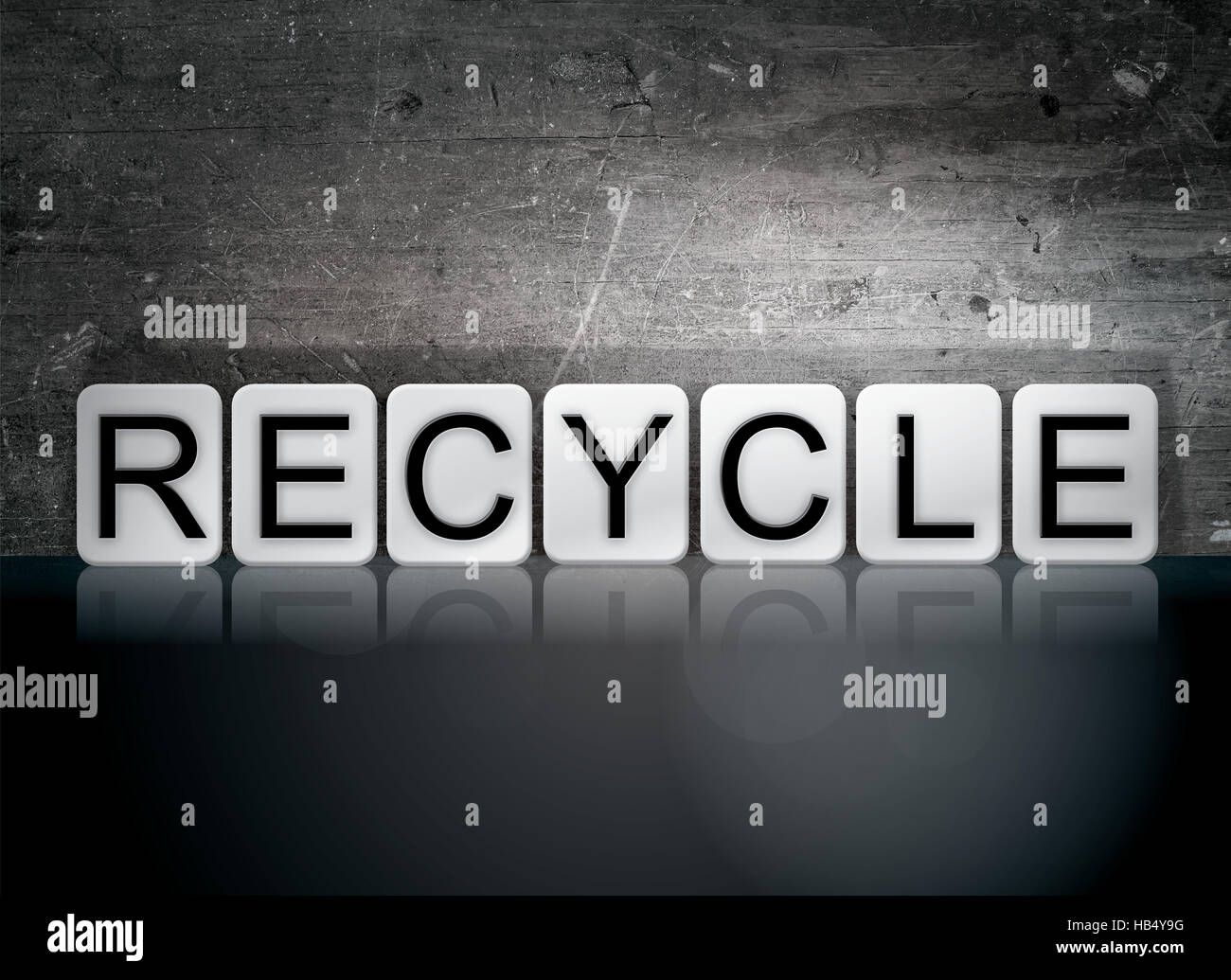 The word "Recycle" written in white tiles against a dark vintage grunge ...