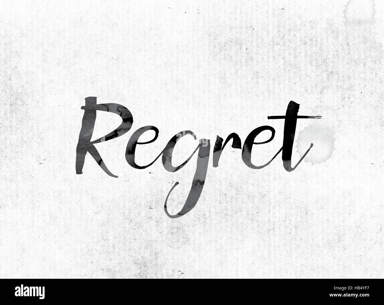 The word "Regret" concept and theme painted in watercolor ink on a ...