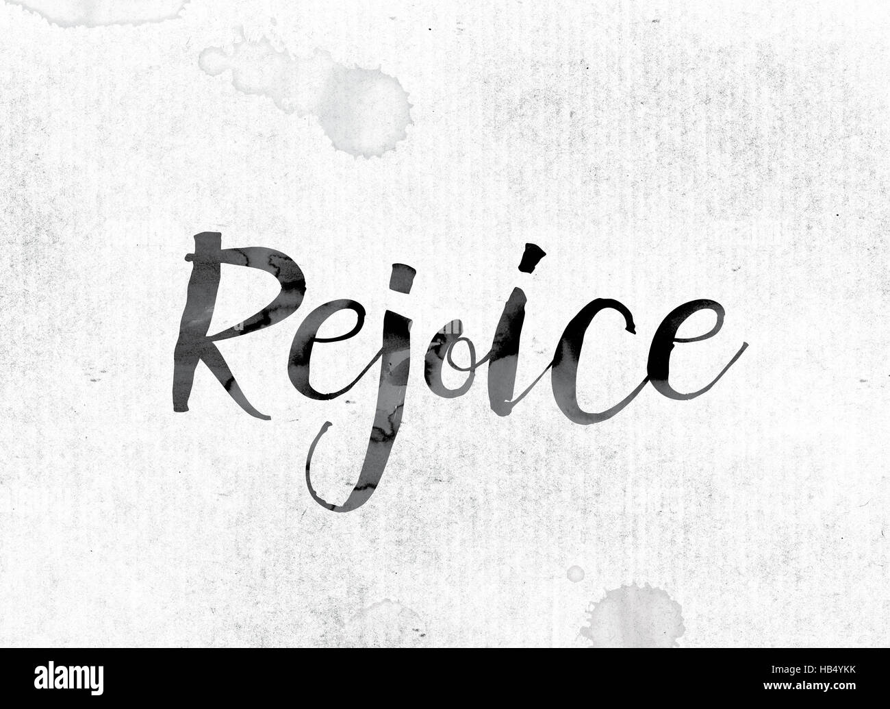 The word "Rejoice" concept and theme painted in watercolor ink on a ...