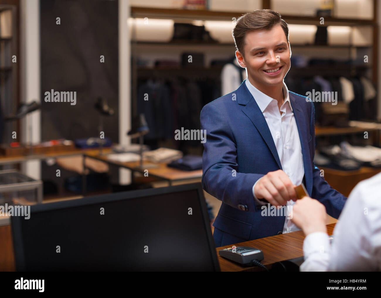 Businessman in store Stock Photo - Alamy
