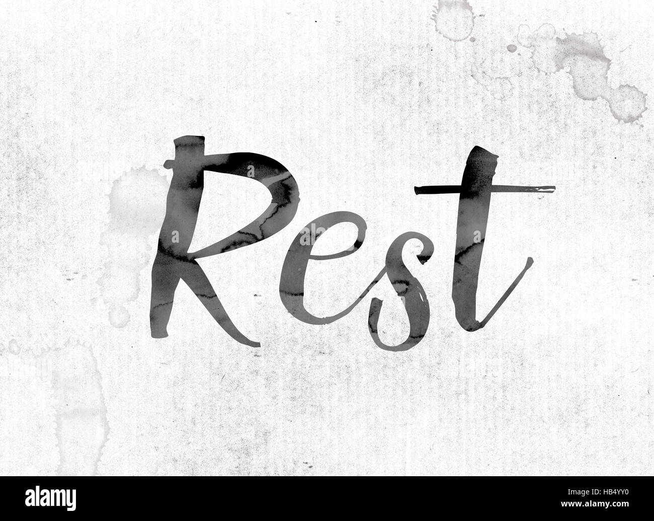 The word "Rest" concept and theme painted in watercolor ink on a white ...