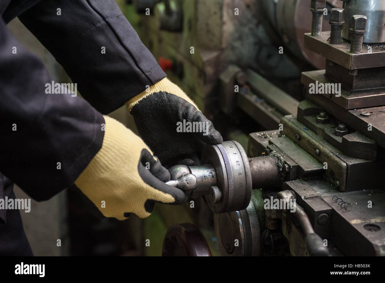 Worker operating machinery in manufacturing hi-res stock photography ...