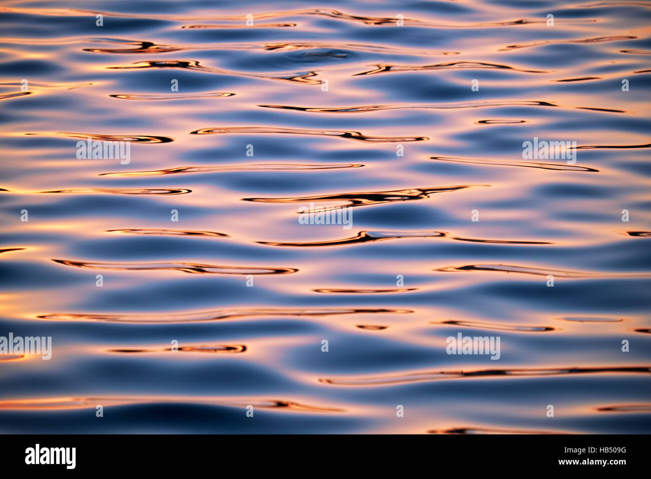 Sunset water reflection background Stock Photo - Alamy