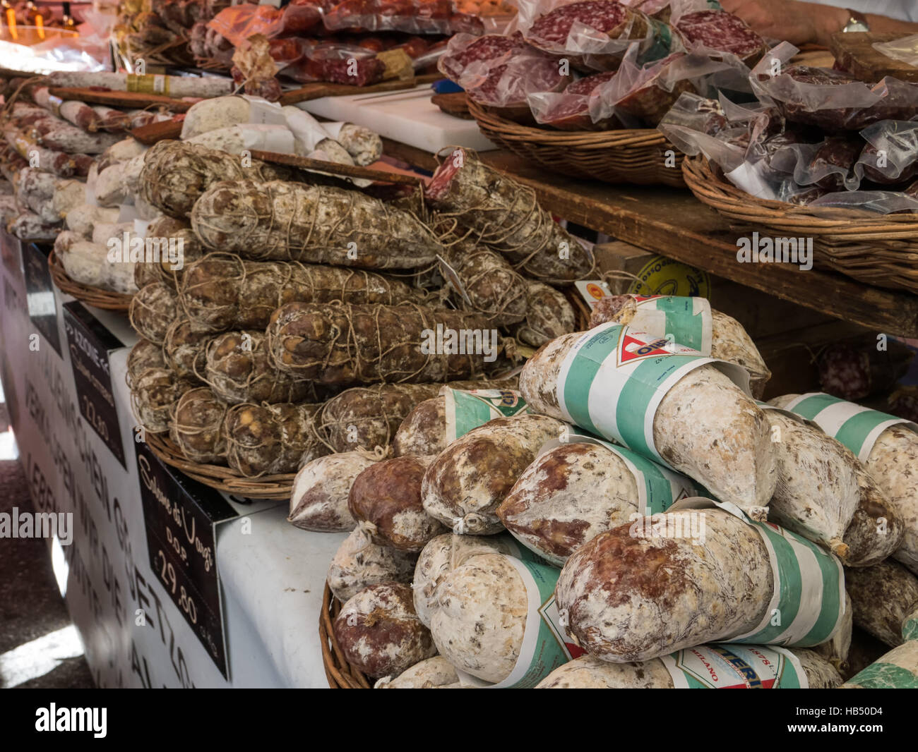 A stall selling salami in Italy Stock Photo - Alamy