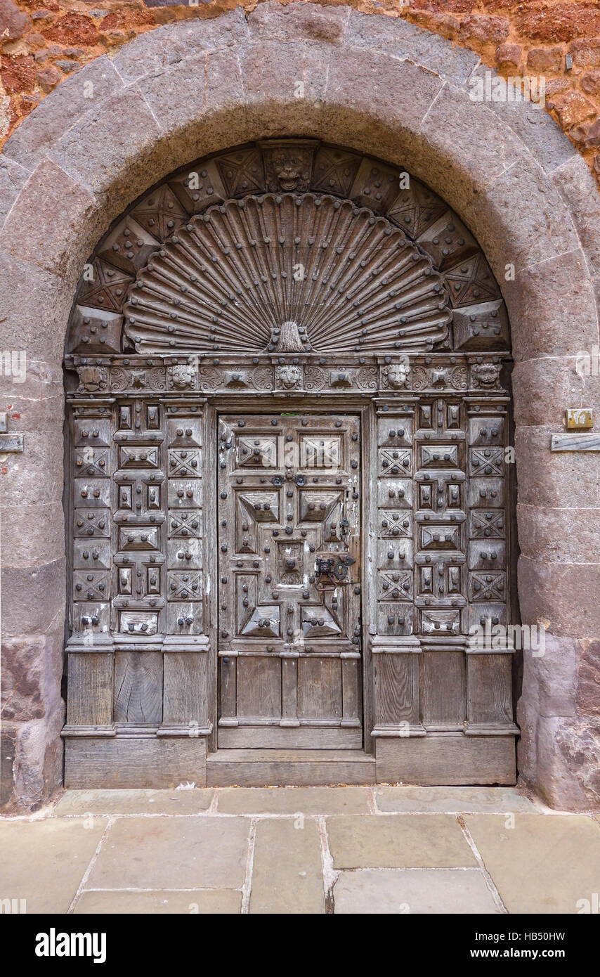 Medieval carved wooden studded door Cathedral close Exeter England ...