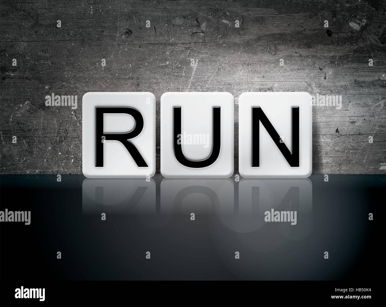 The word "Run" written in white tiles against a dark vintage grunge ...