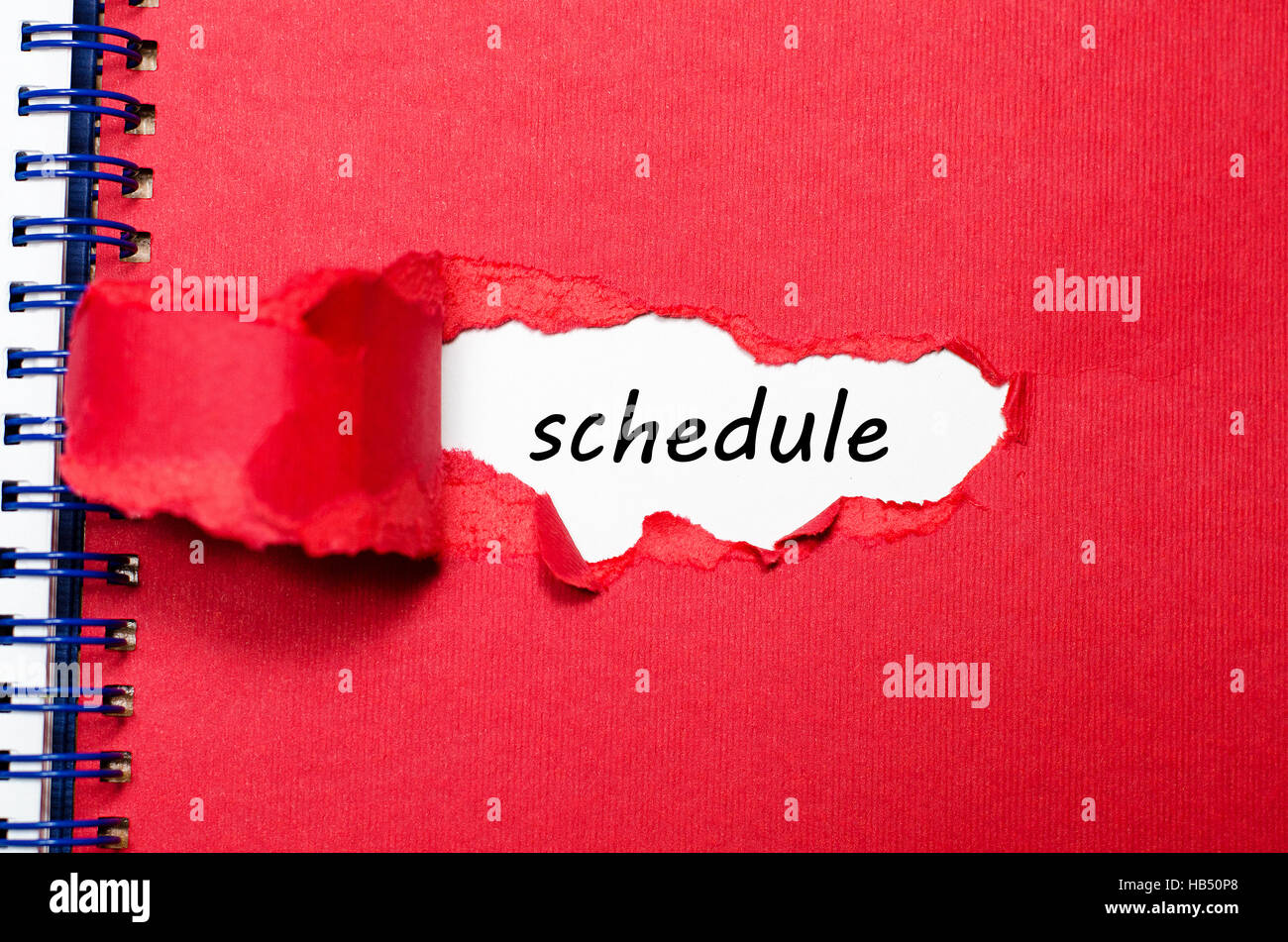 The word schedule appearing behind torn paper Stock Photo - Alamy