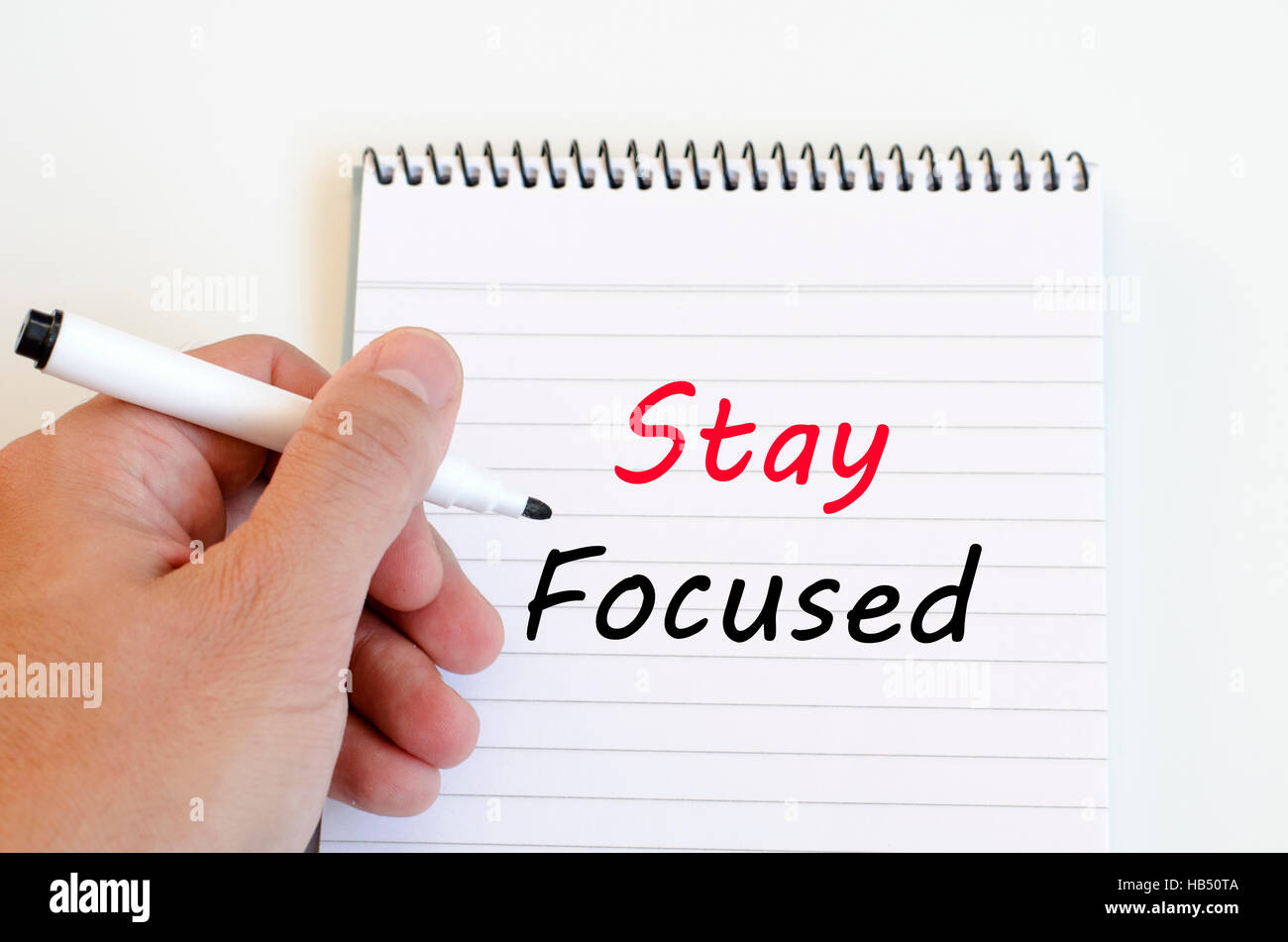 Stay focused text concept write on notebook Stock Photo - Alamy