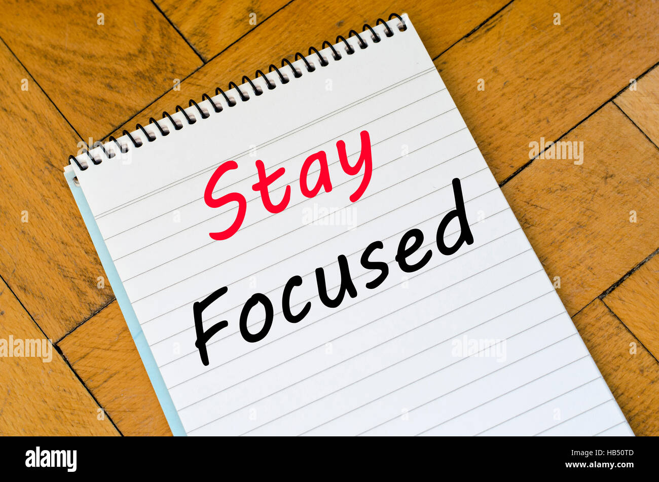 Stay focused text concept write on notebook Stock Photo - Alamy
