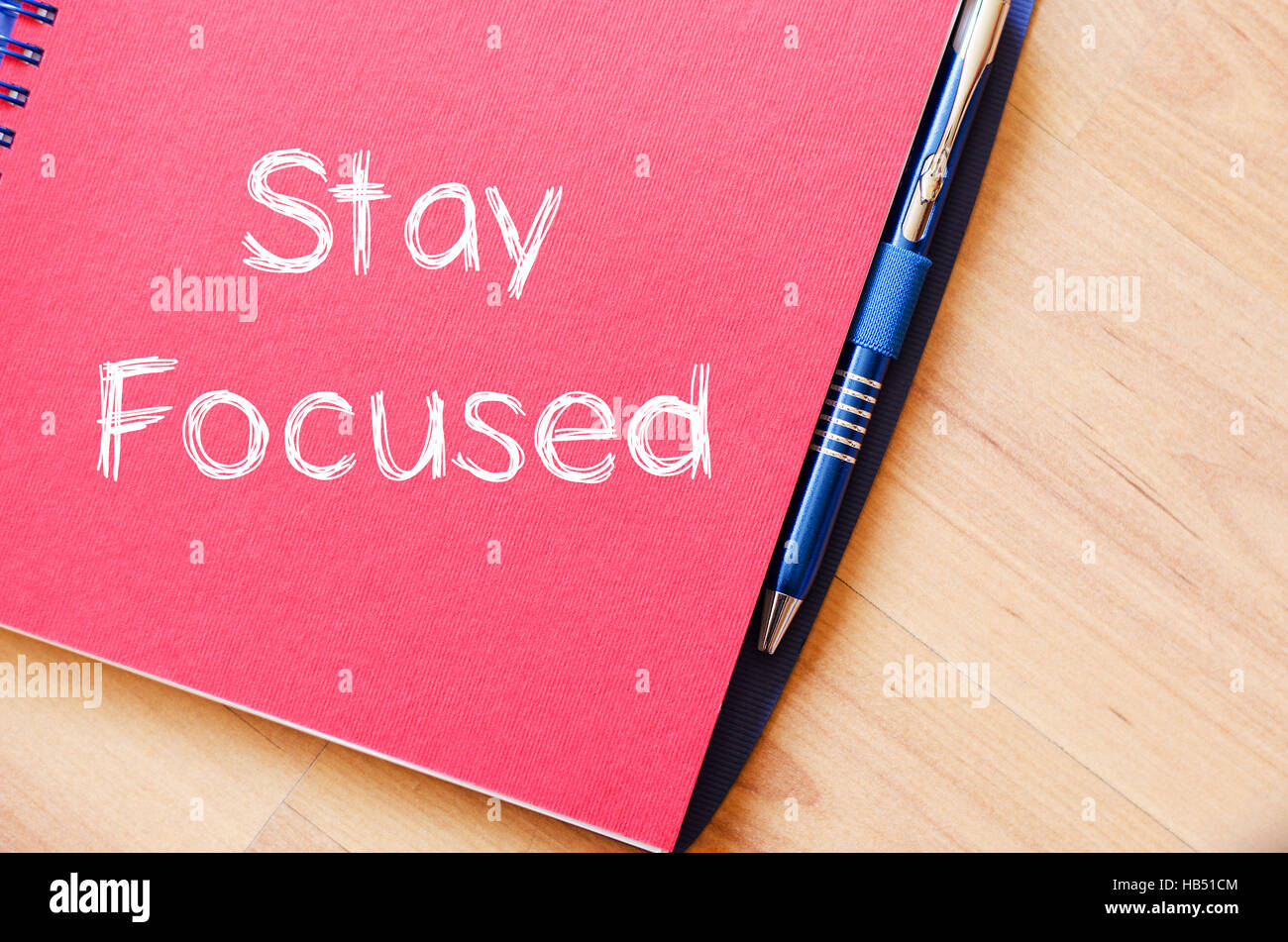 Stay focused text concept write on notebook Stock Photo - Alamy