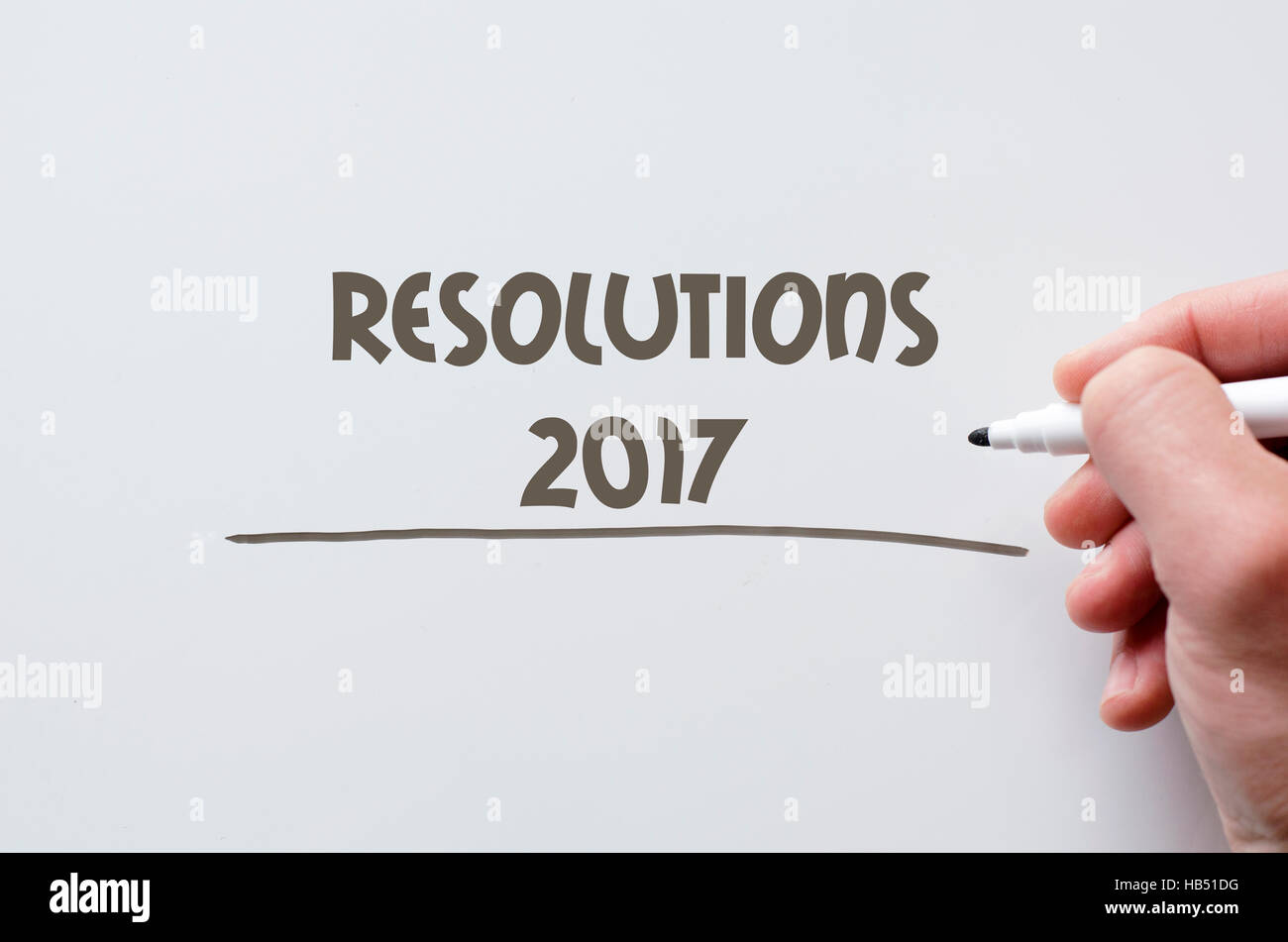 Human hand writing resolutions 2017 on whiteboard Stock Photo - Alamy