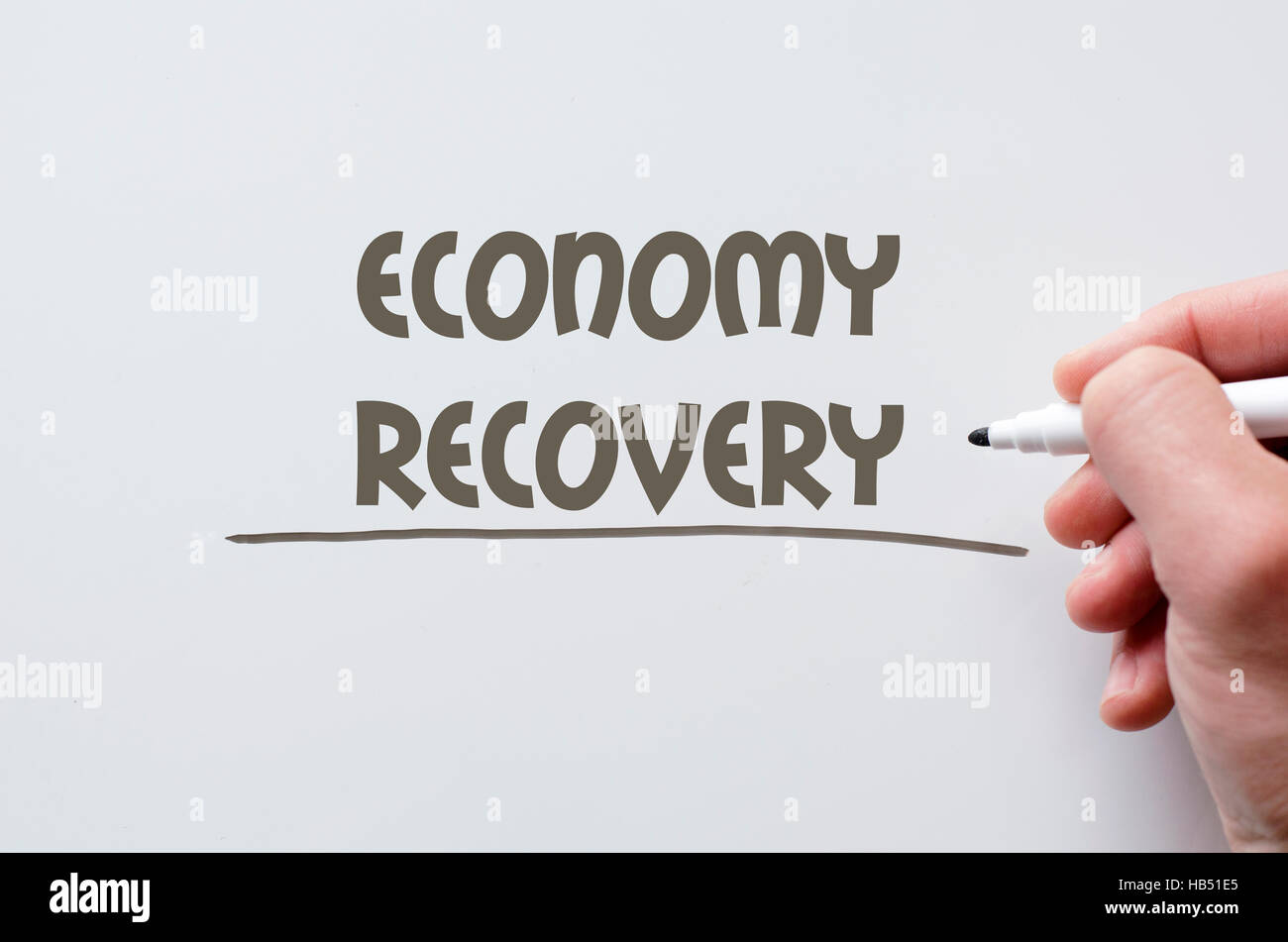 Human hand writing economy recovery on whiteboard Stock Photo - Alamy