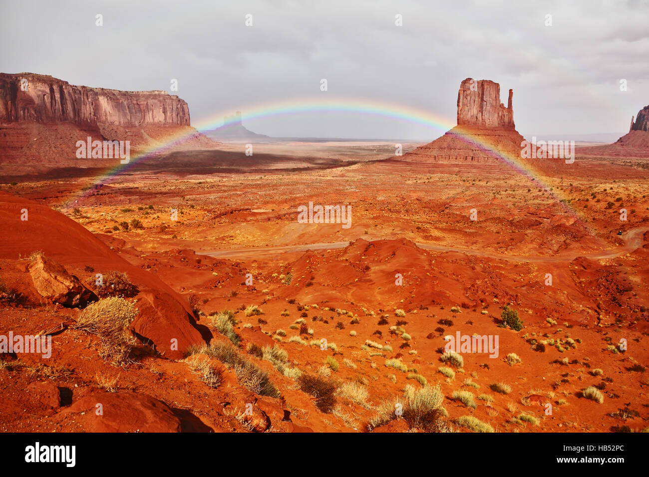 Rainbow and red stone desert Stock Photo - Alamy