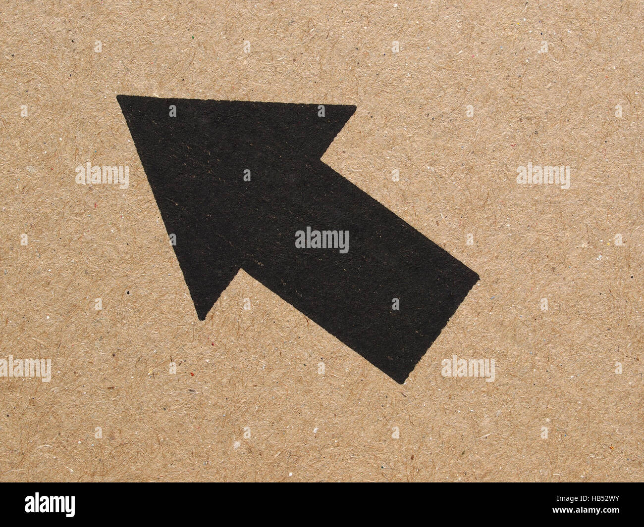 Black arrow on cardboard Stock Photo - Alamy