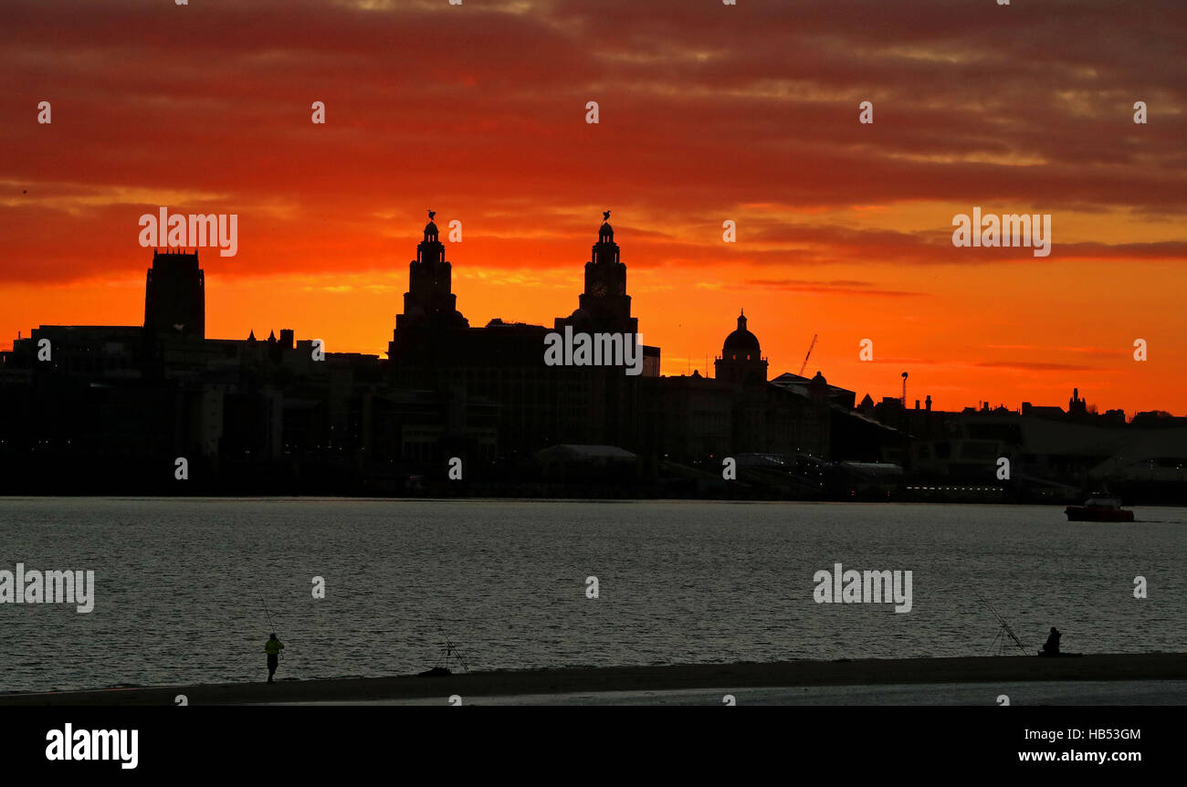 The sun rises behind liver building over liverpool waterfront hi-res ...