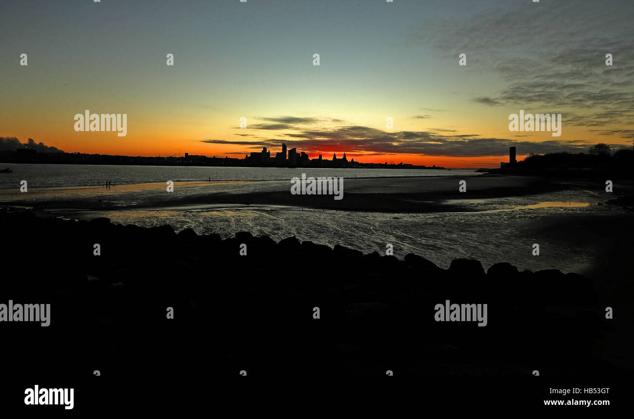 The sun rises behind the Liver Building over the Liverpool waterfront ...