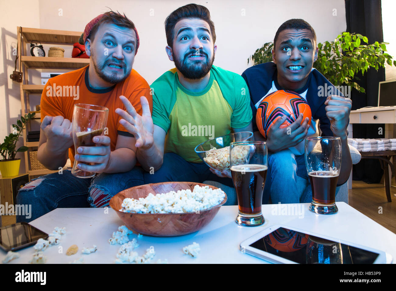 Excited young people watching football hi-res stock photography and ...