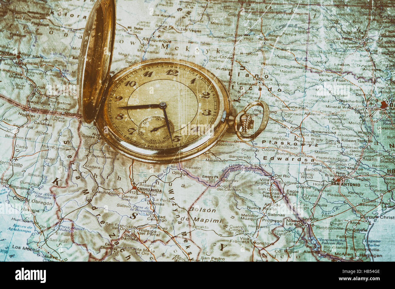 Photo of old watch on map Stock Photo - Alamy