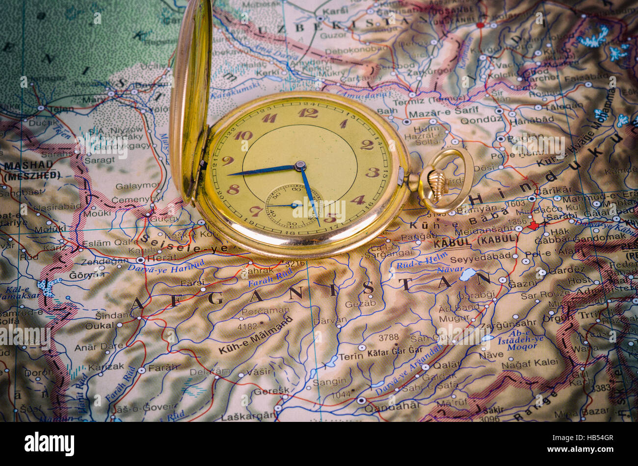 Photo of old watch on map Stock Photo - Alamy