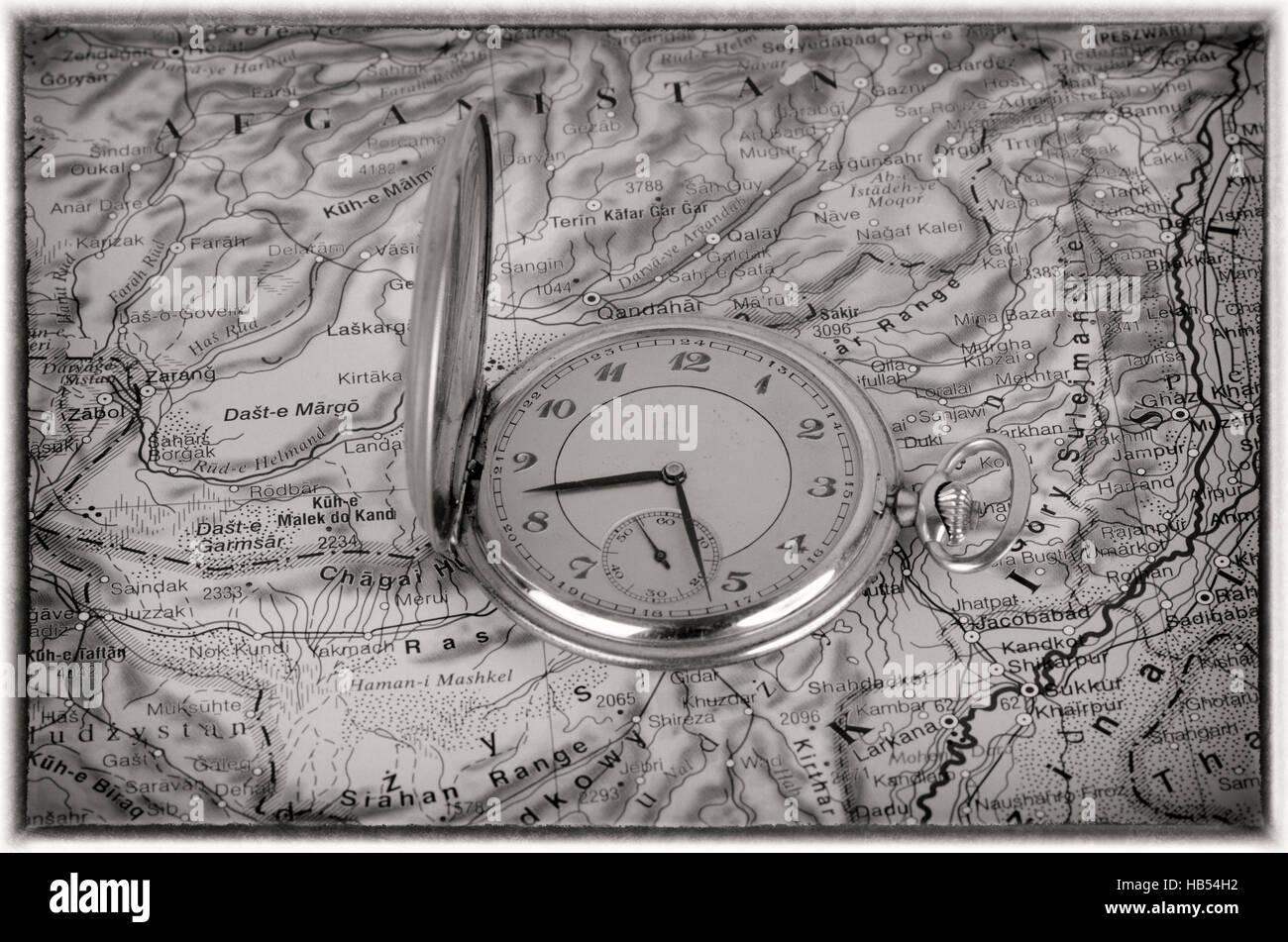Photo of old watch on map Stock Photo - Alamy