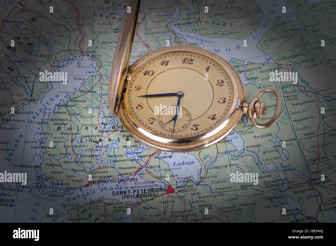 Photo of old watch on map Stock Photo - Alamy