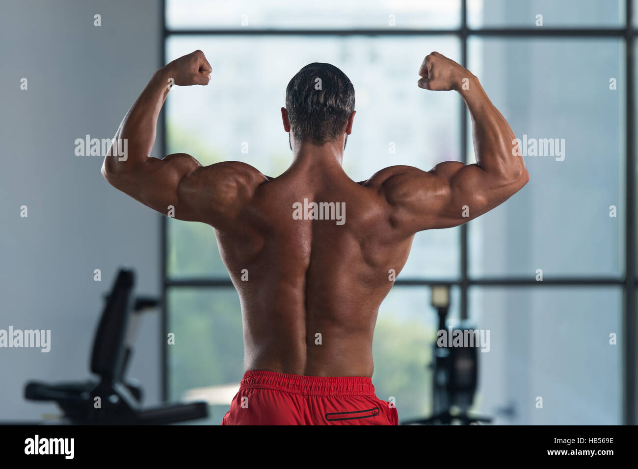 Double biceps pose young attractive hi-res stock photography and images ...