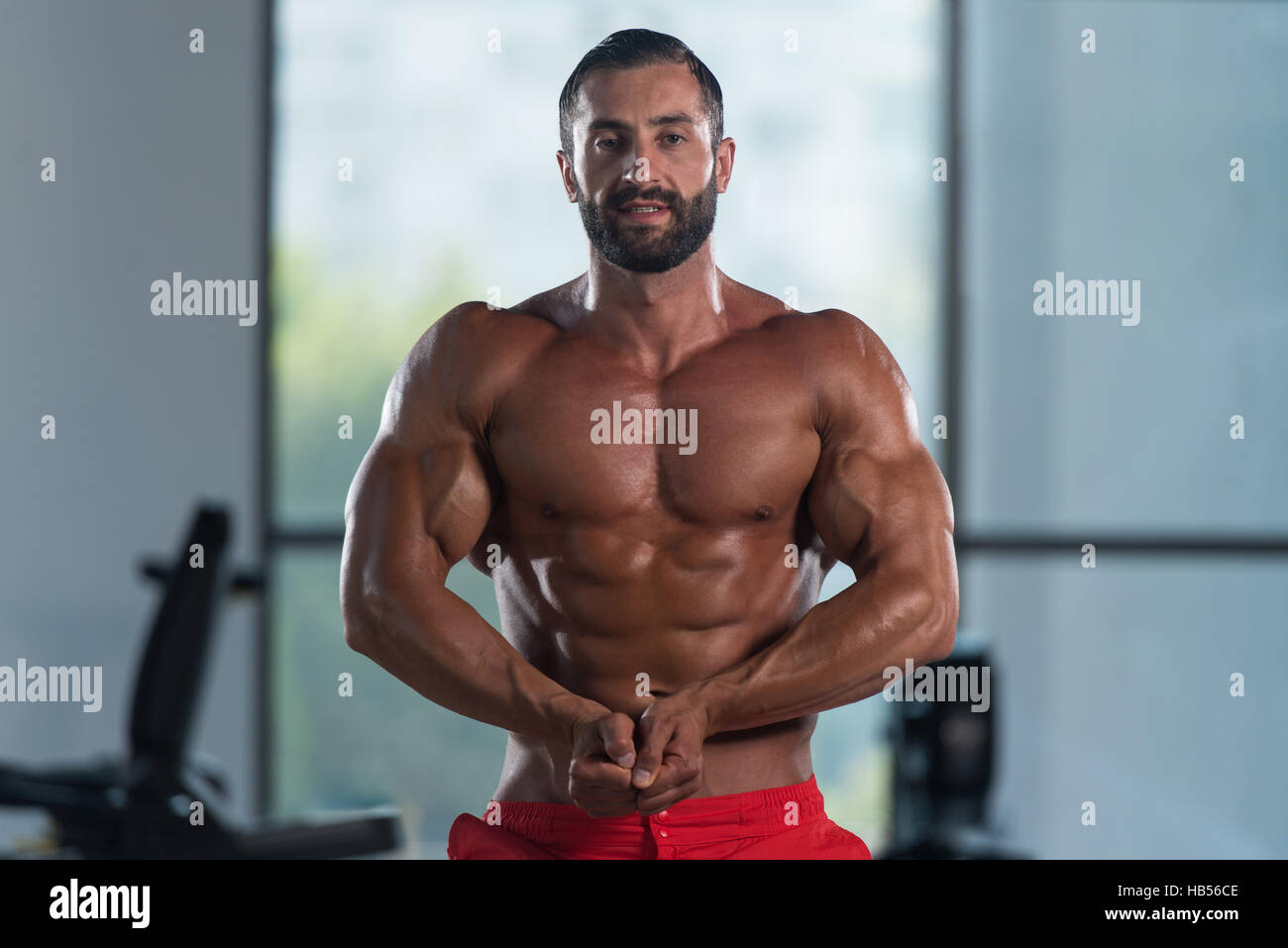 Portrait Of A Young Physically Fit Hispanic Man Showing His Well ...
