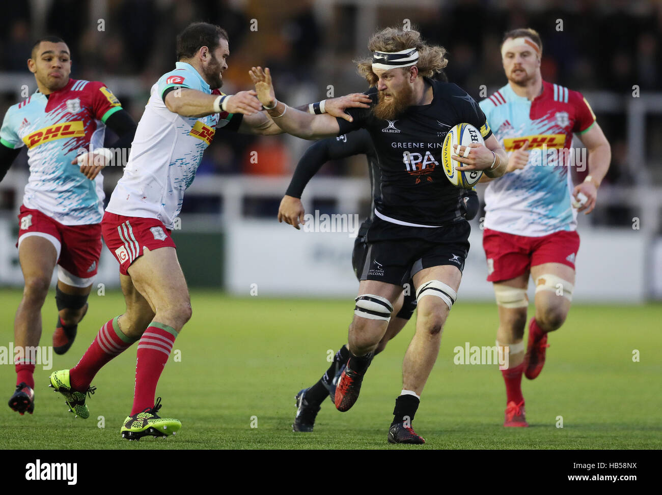 Newcastle Falcons Evan Olmstead pushes off Harlequins Jamie Roberts ...