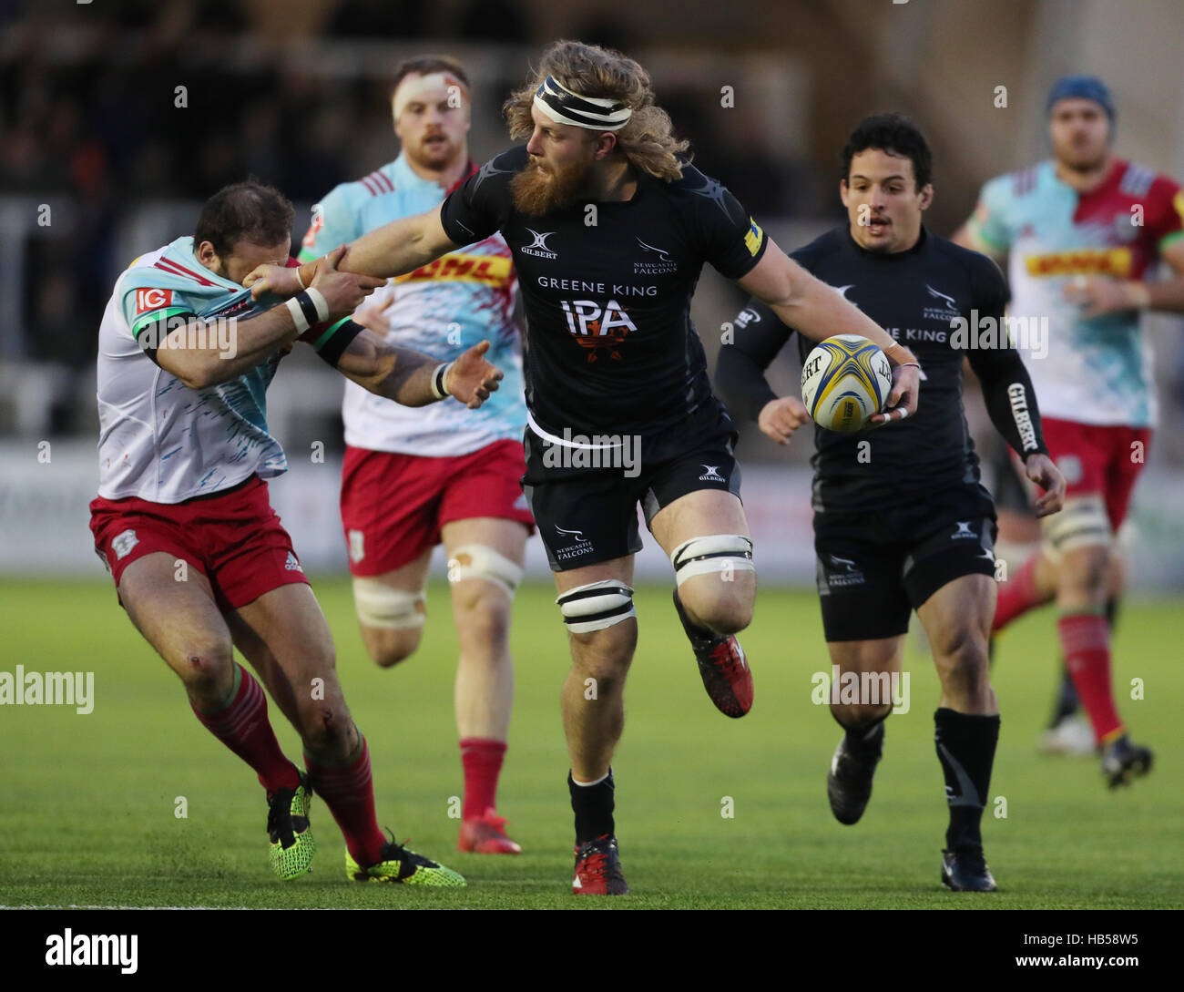 Newcastle Falcons Evan Olmstead pushes off Harlequins Jamie Roberts ...
