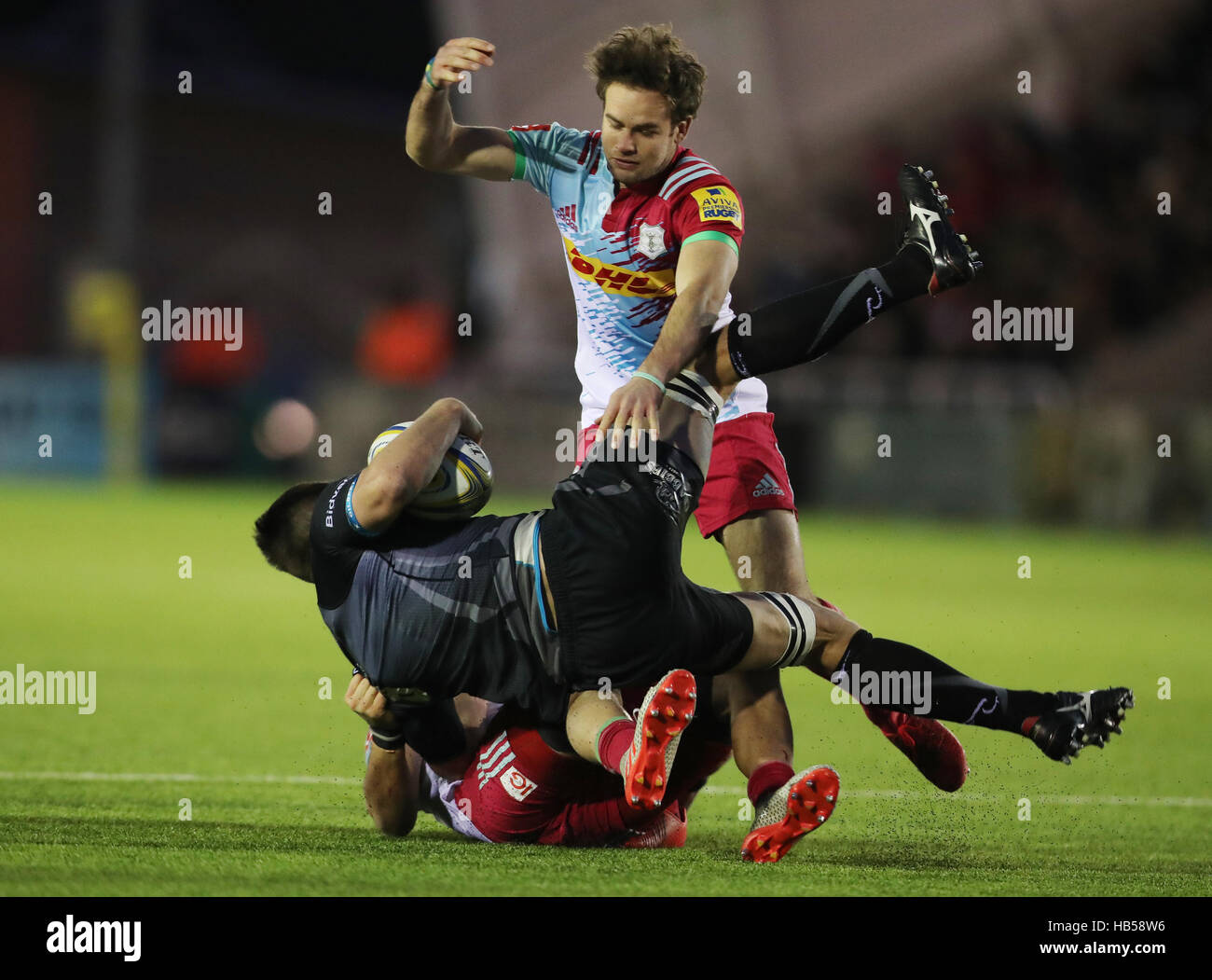 Newcastle Falcons Ally Hogg is tackled by Harlequins Ruaridh Jackson ...