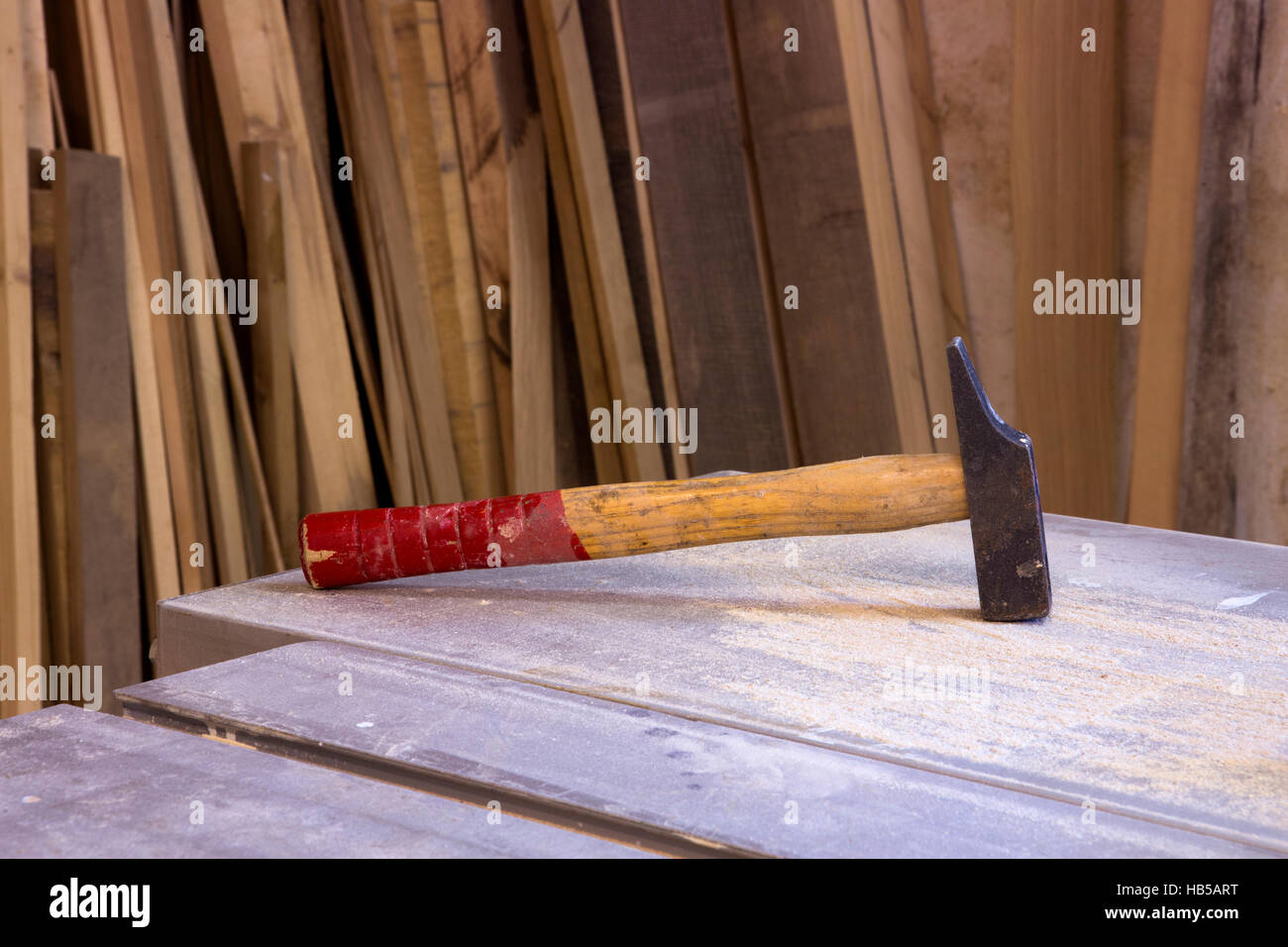hammer on a table at a wood workshop Stock Photo - Alamy