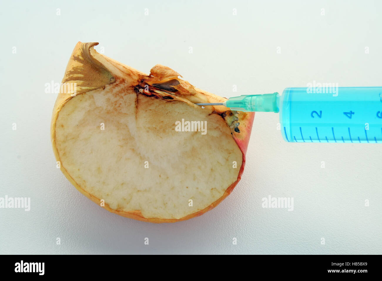 Laboratory test on a apple. Genetic modified food Stock Photo - Alamy