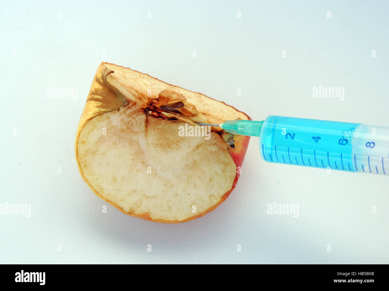 Laboratory test on a apple. Genetic modified food Stock Photo - Alamy