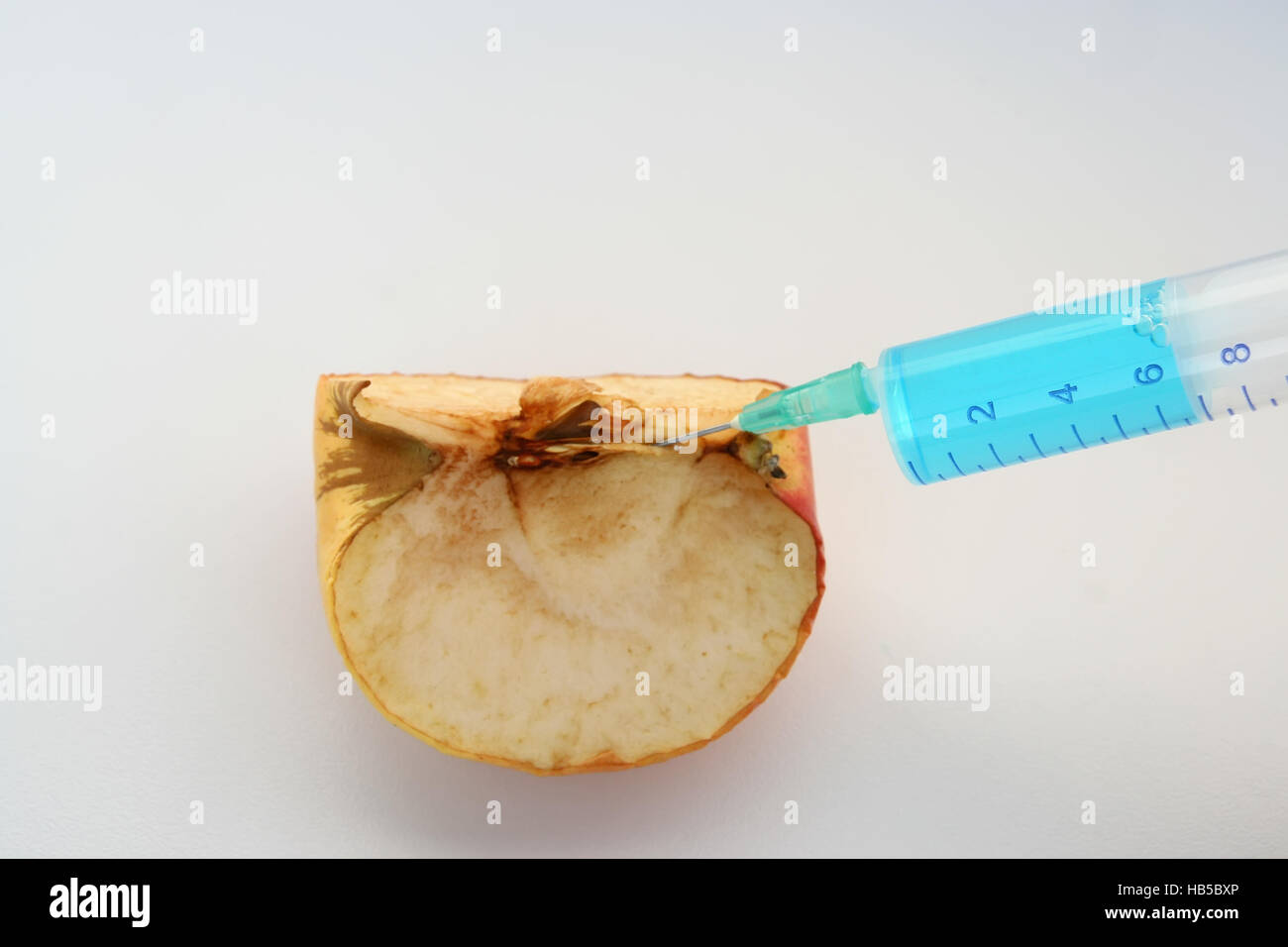 Laboratory test on a apple. Genetic modified food Stock Photo - Alamy