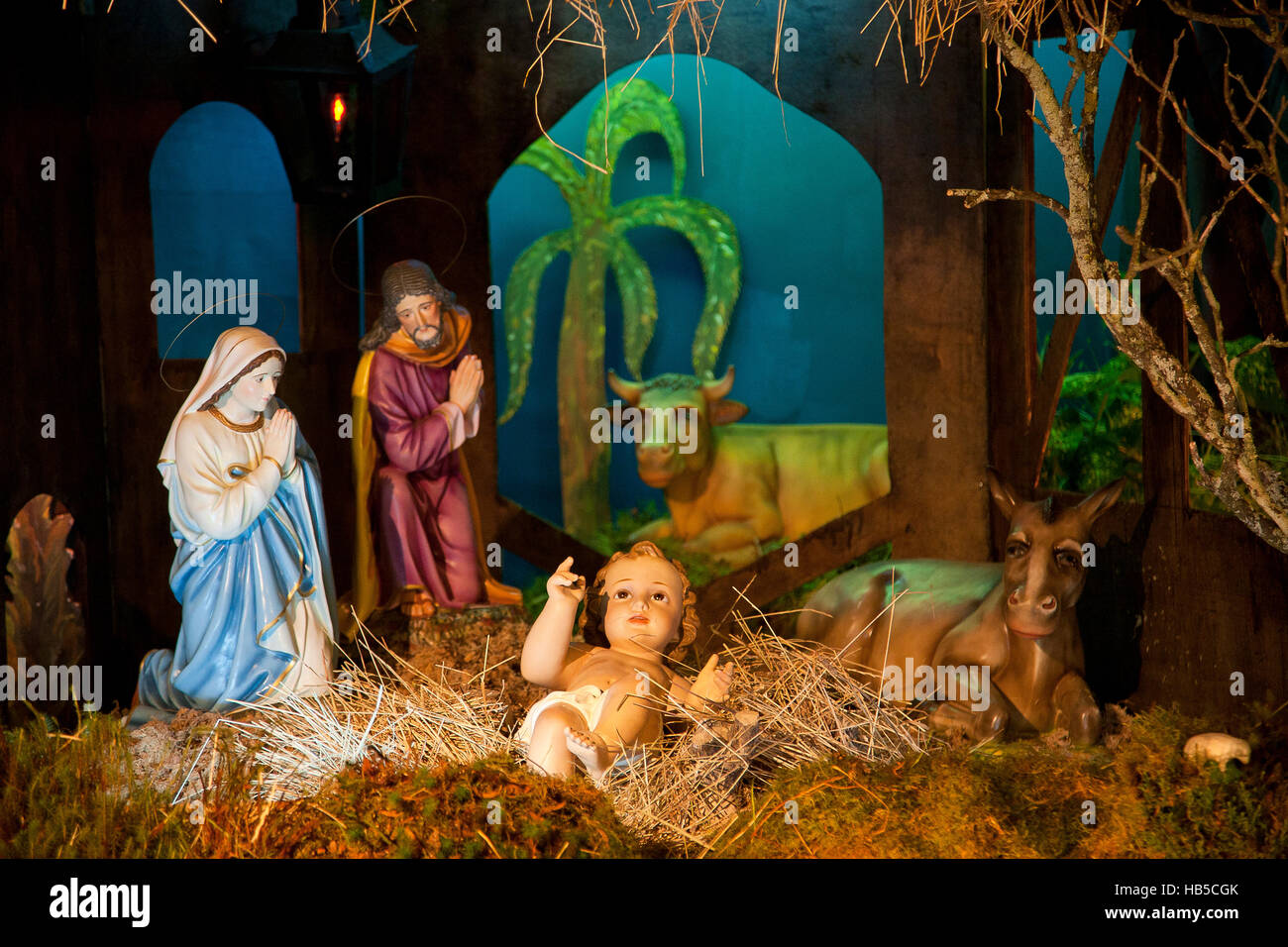 Nativity scene with baby Jesus, Virgin Mary, Saint Joseph, cow and ...