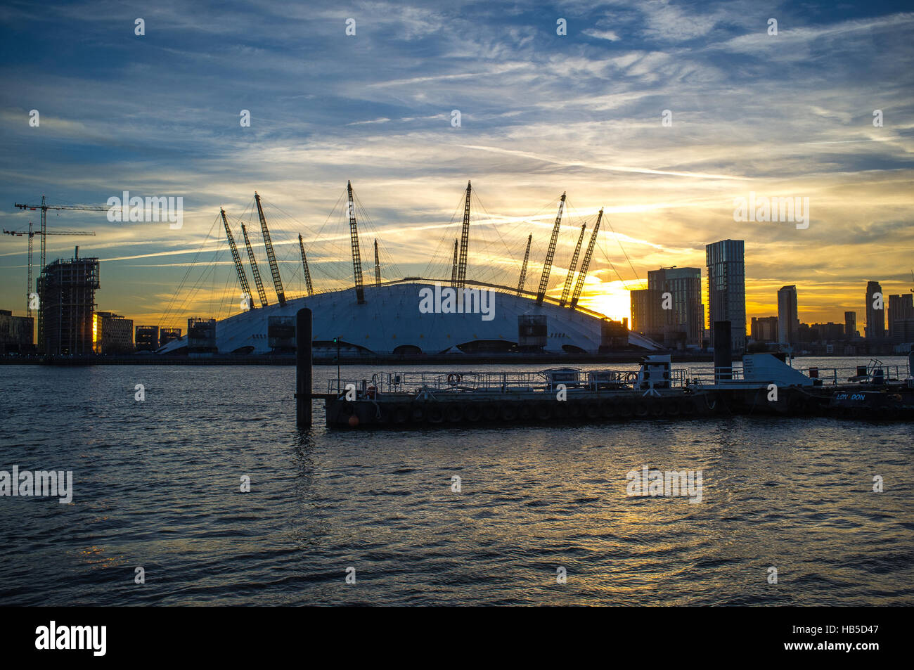 London, UK. 04th Dec, 2016. The Sunset on The O2 and the docks pictured ...