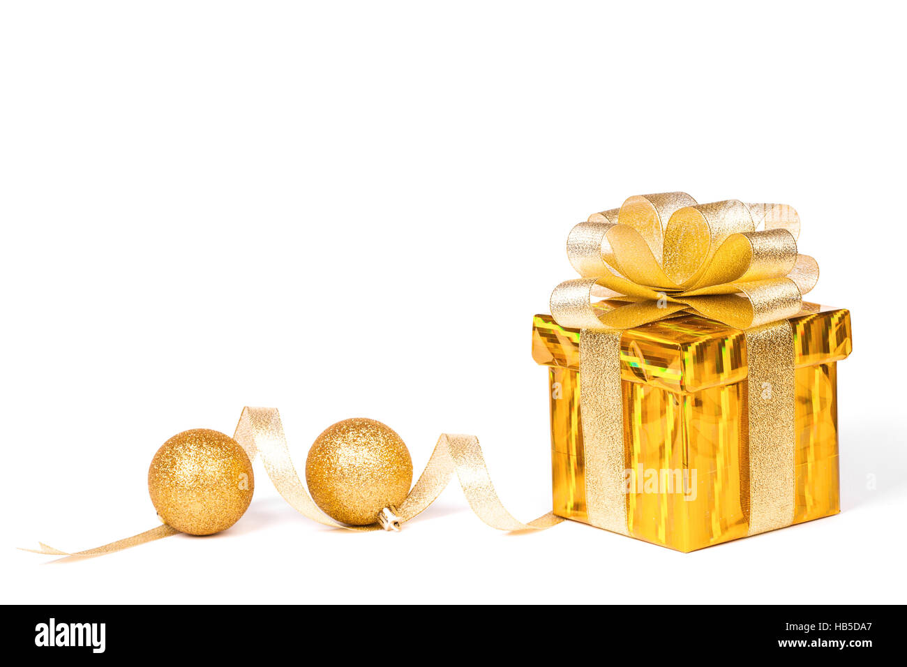Christmas gold gift box isolated on white background Stock Photo - Alamy