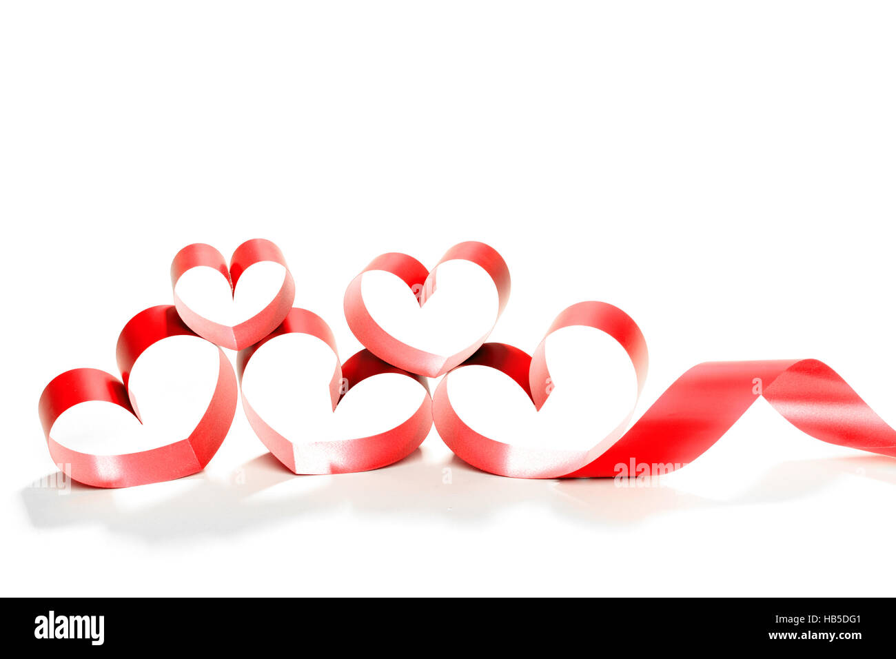 red heart ribbon isolated on white background Stock Photo - Alamy