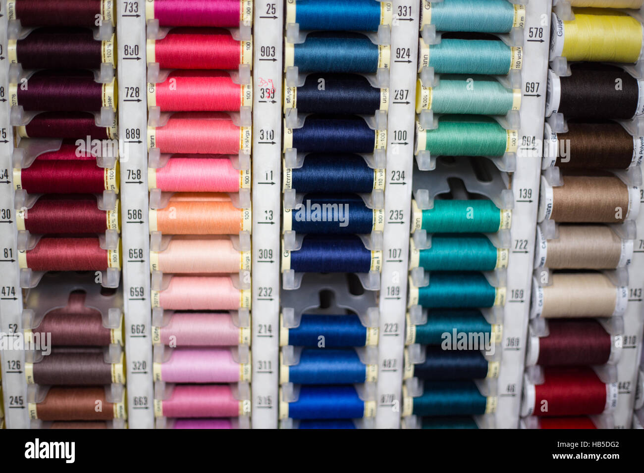 Colored threads in sewing shop hi-res stock photography and images - Alamy