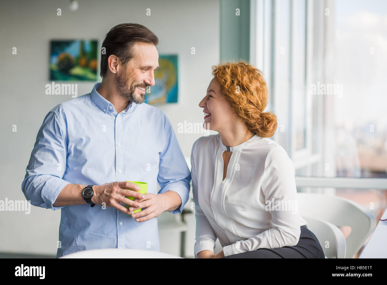 Business people having break during work in office interior Stock Photo ...
