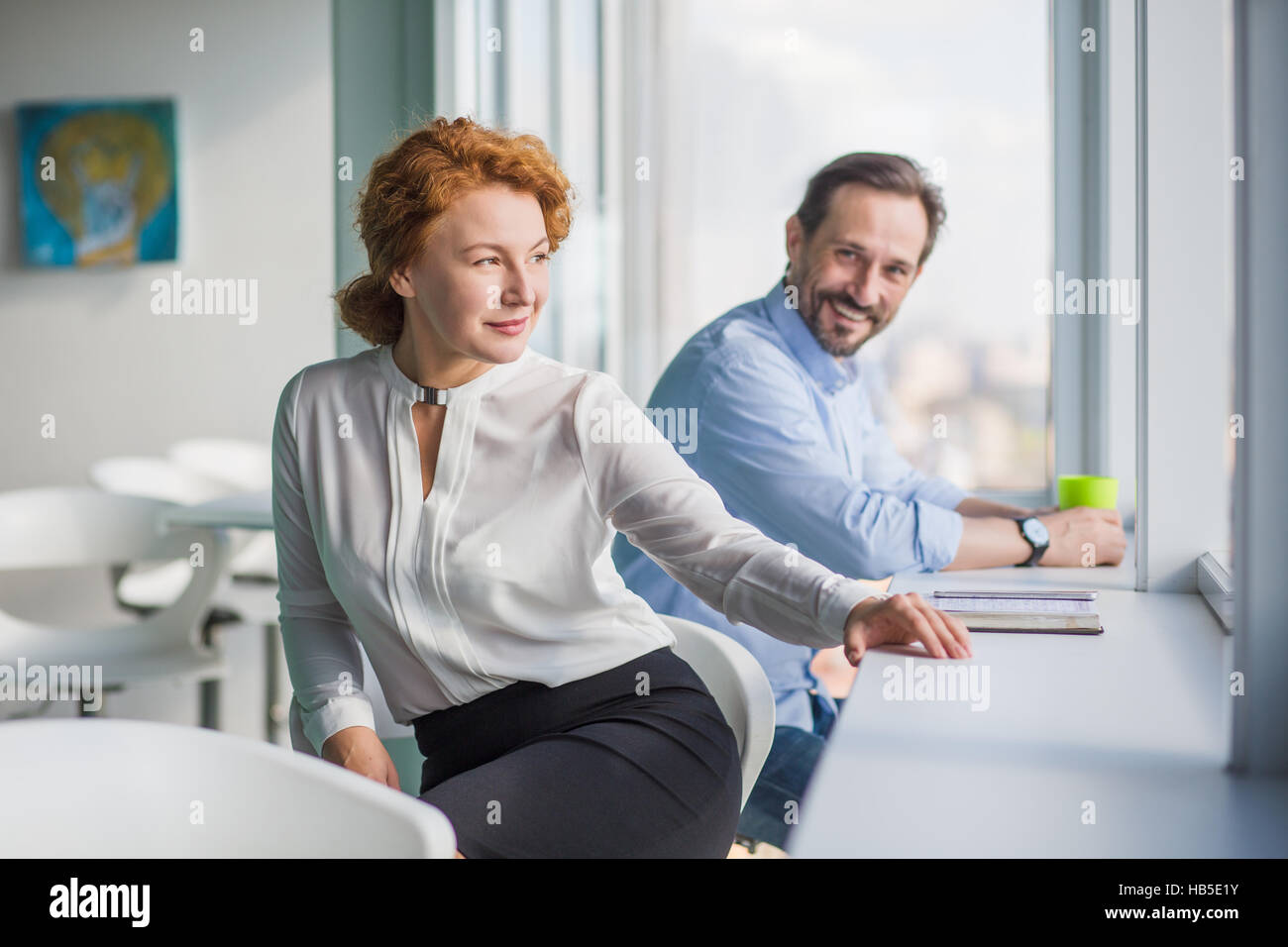 Business people having break during work in office interior Stock Photo ...