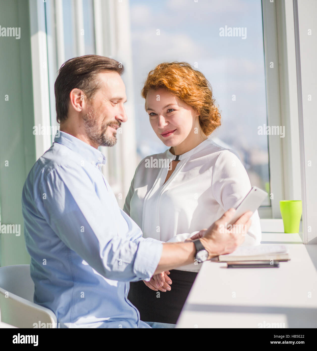 Business people having break during work in office interior Stock Photo ...