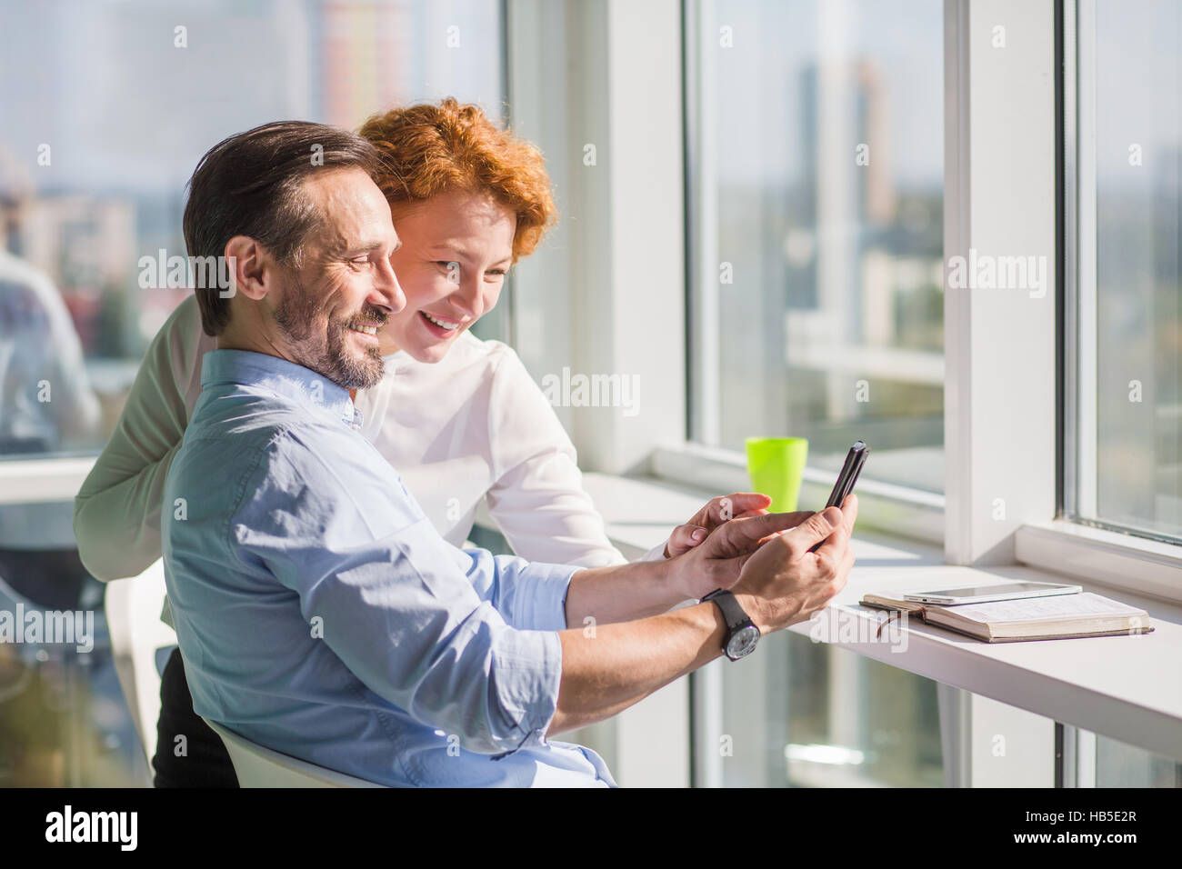 Business people having break during work in office interior Stock Photo ...